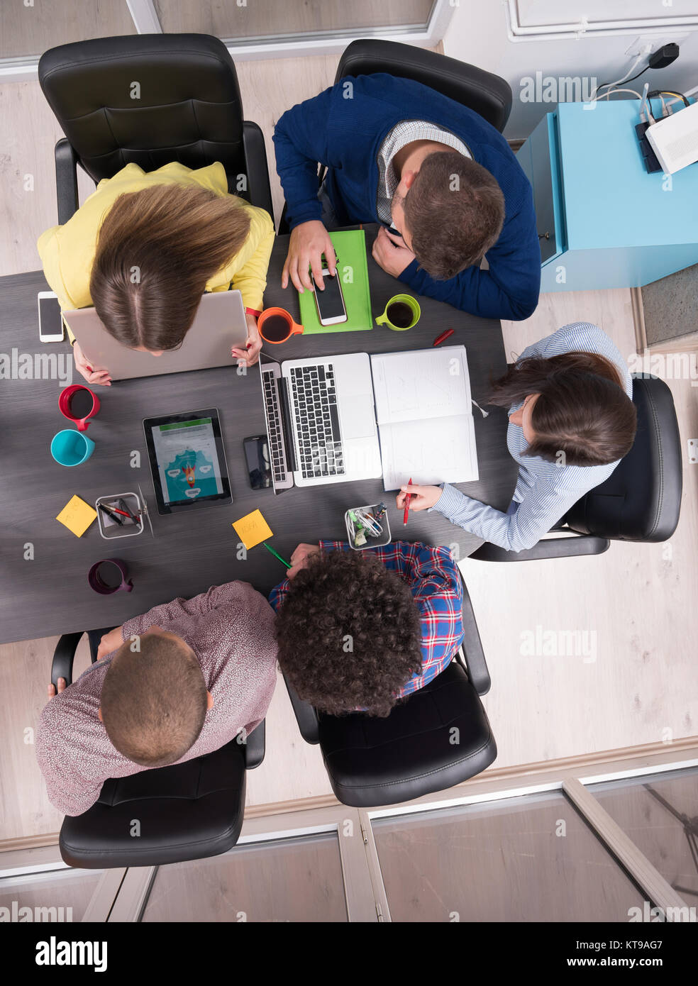Portrait of startup group of creative people having a meeting with a ...