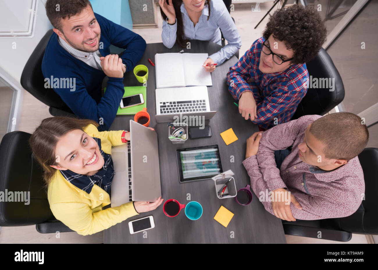 Portrait of startup group of creative people having a meeting with a ...