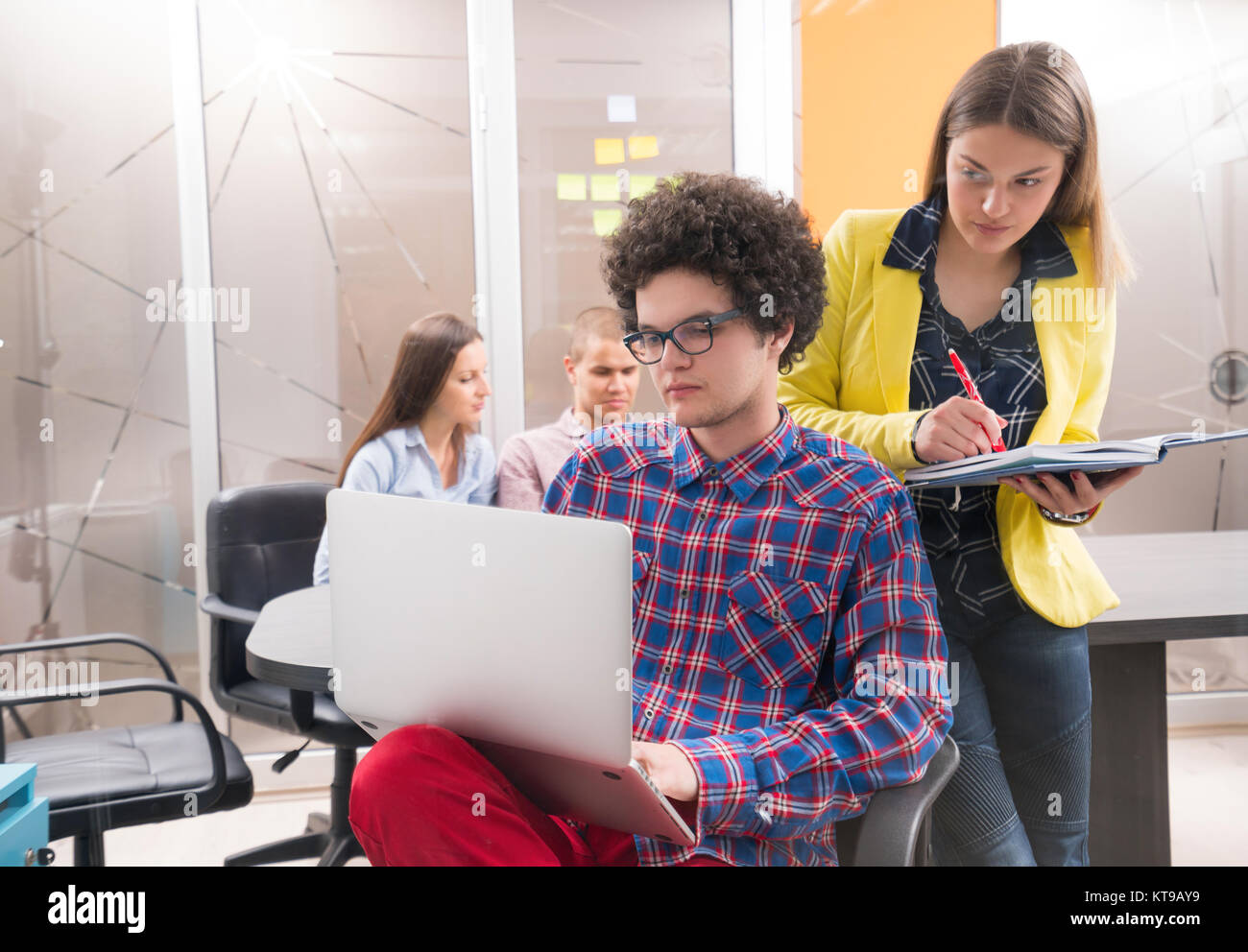 Portrait of startup group of creative people having a meeting with a ...