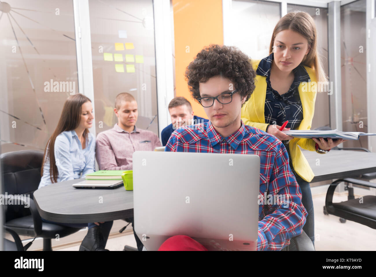 Portrait of startup group of creative people having a meeting with a ...