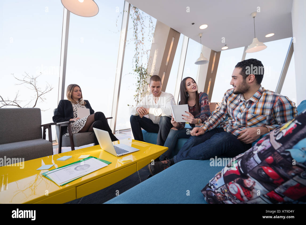 Group of young adults coworking together Stock Photo - Alamy