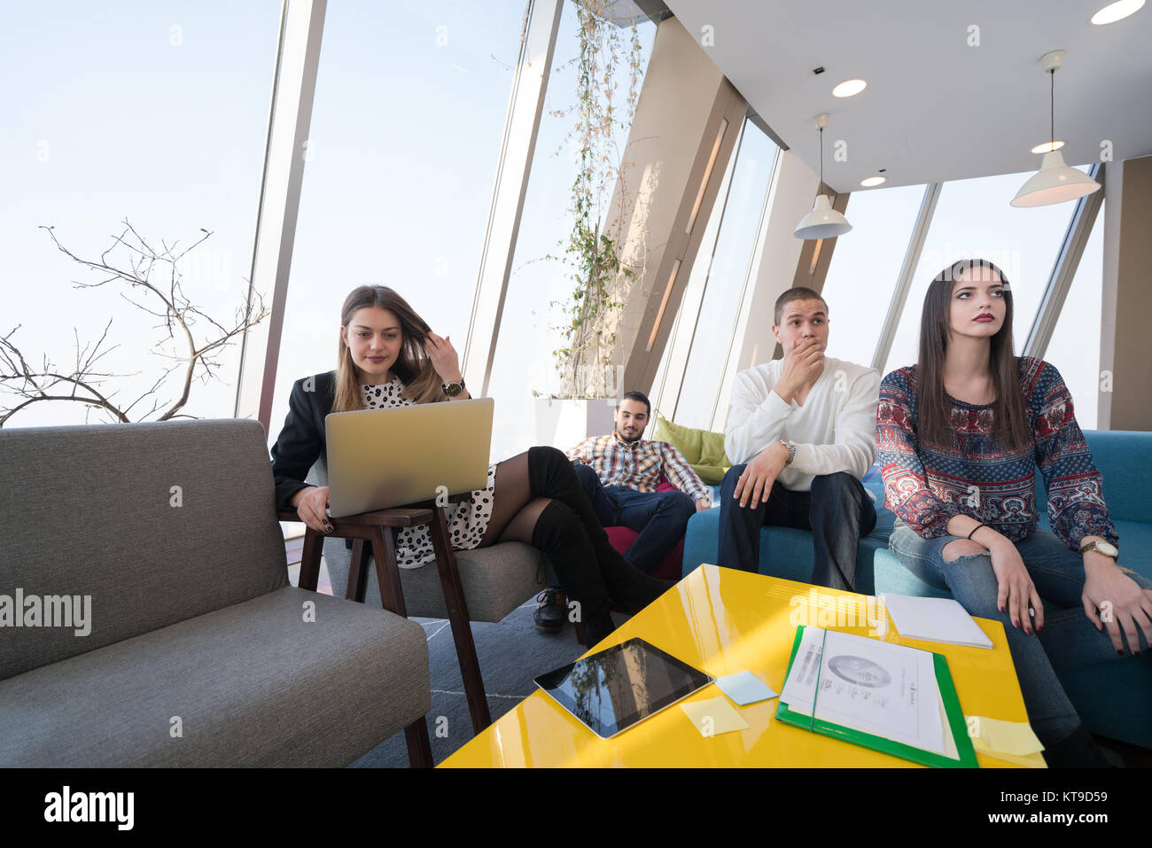 Group of young adults coworking together Stock Photo - Alamy