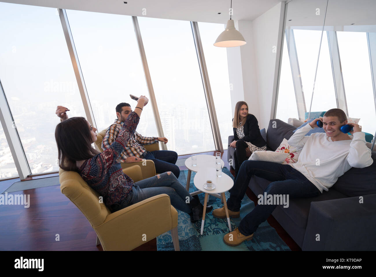 Group of young adults coworking together Stock Photo - Alamy