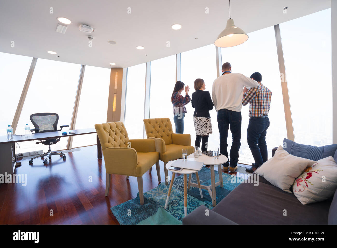 Group of adults resting after work Stock Photo - Alamy