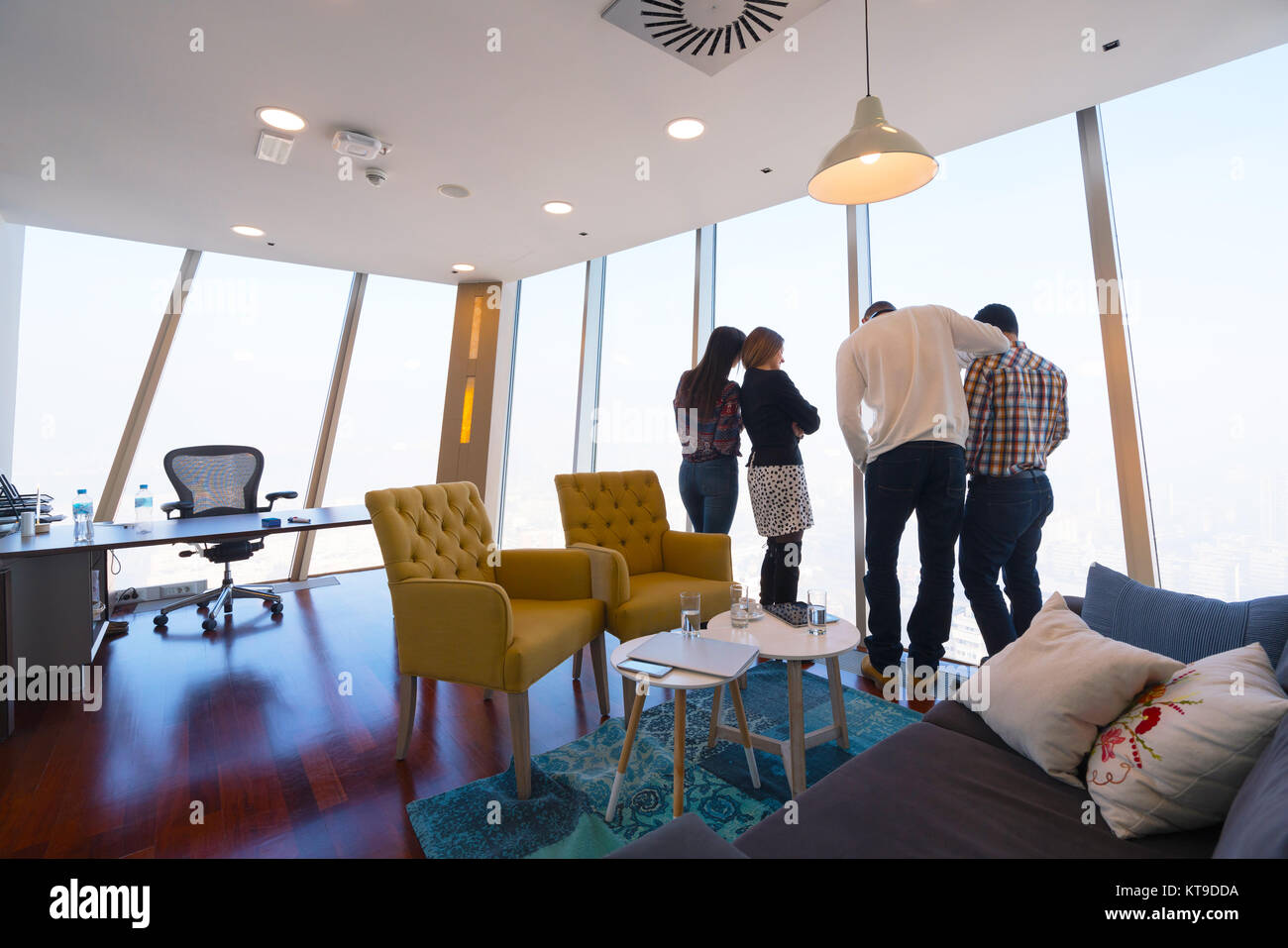 Group of adults resting after work Stock Photo - Alamy