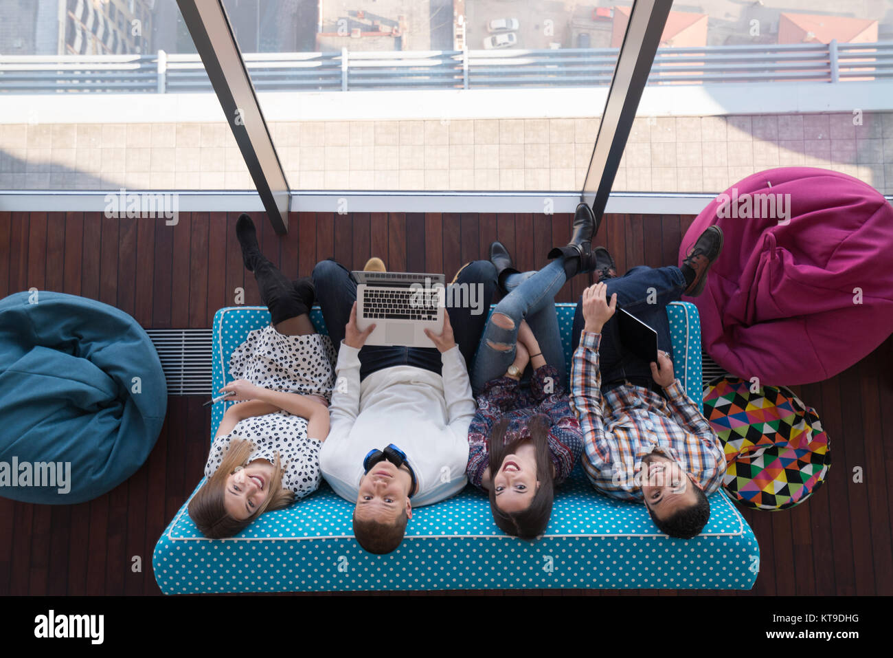 Group of young adults working Stock Photo - Alamy