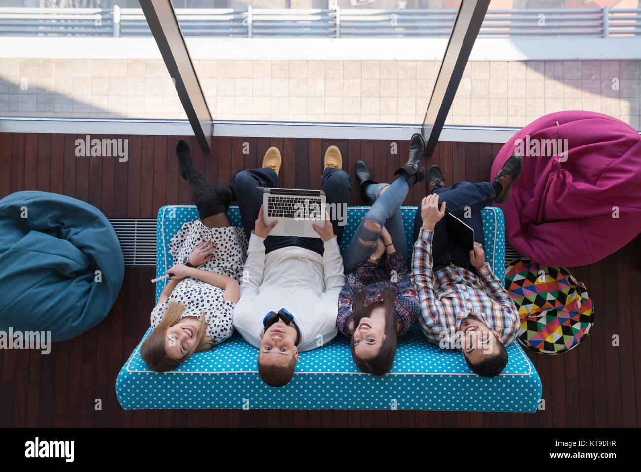 Group of young adults working Stock Photo - Alamy