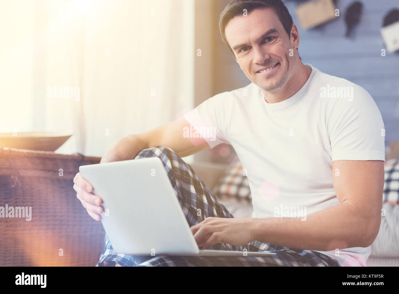 No hurry. Attractive enthusiastic refreshed guy enjoying his time at ...