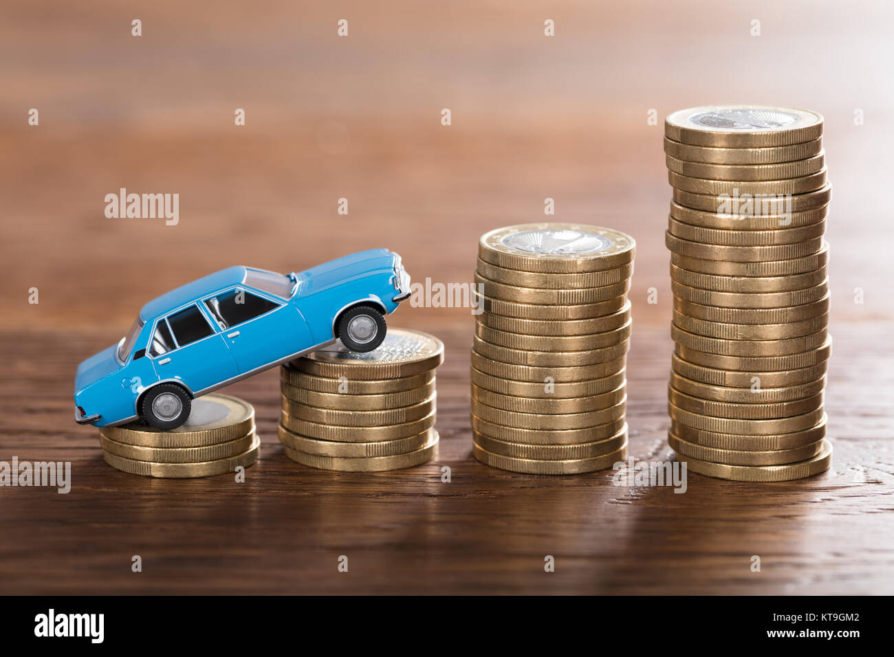 Car Model On Stacked Coin Stock Photo - Alamy