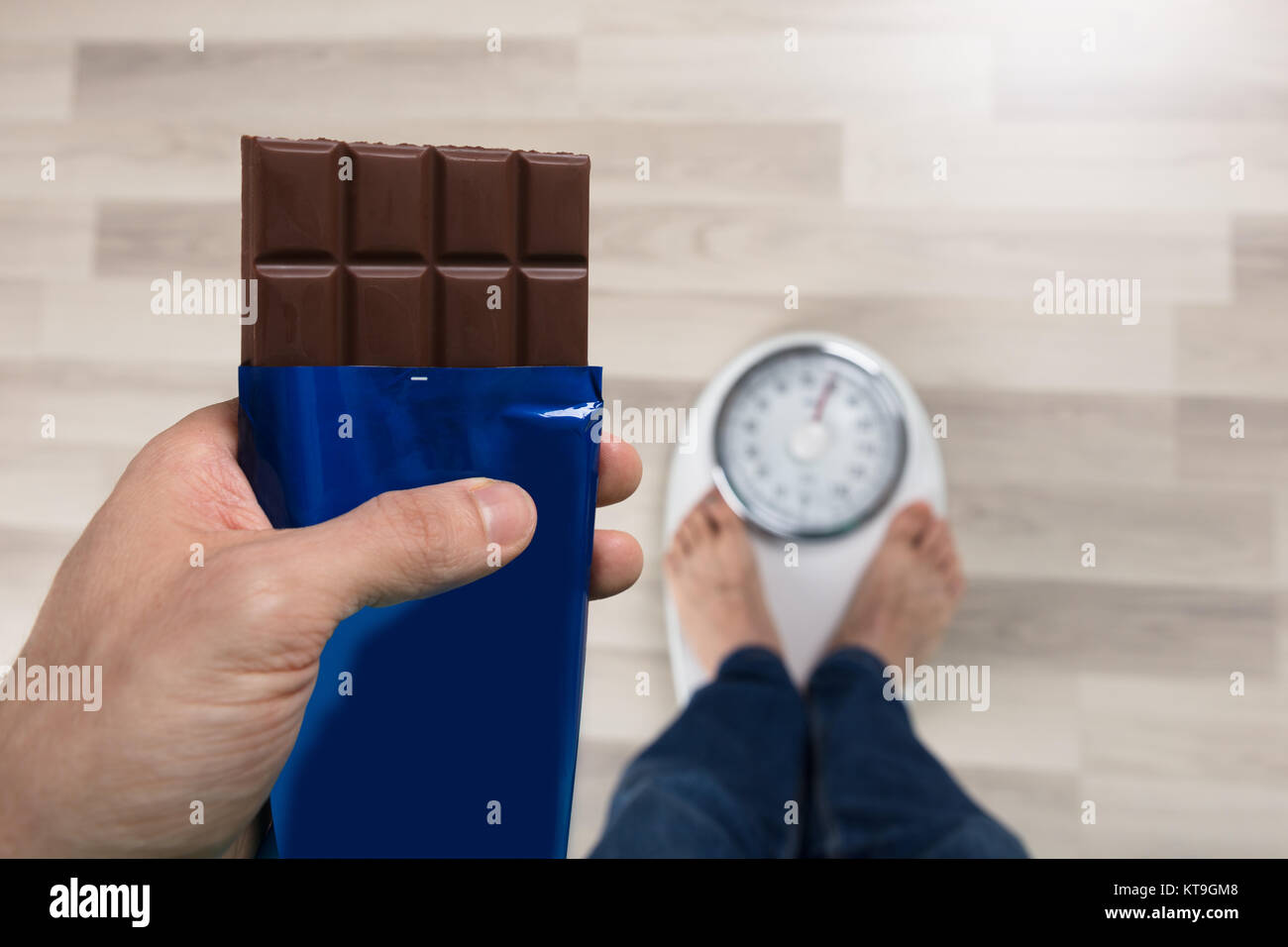 Person Holding Chocolate Measuring Weight Stock Photo - Alamy