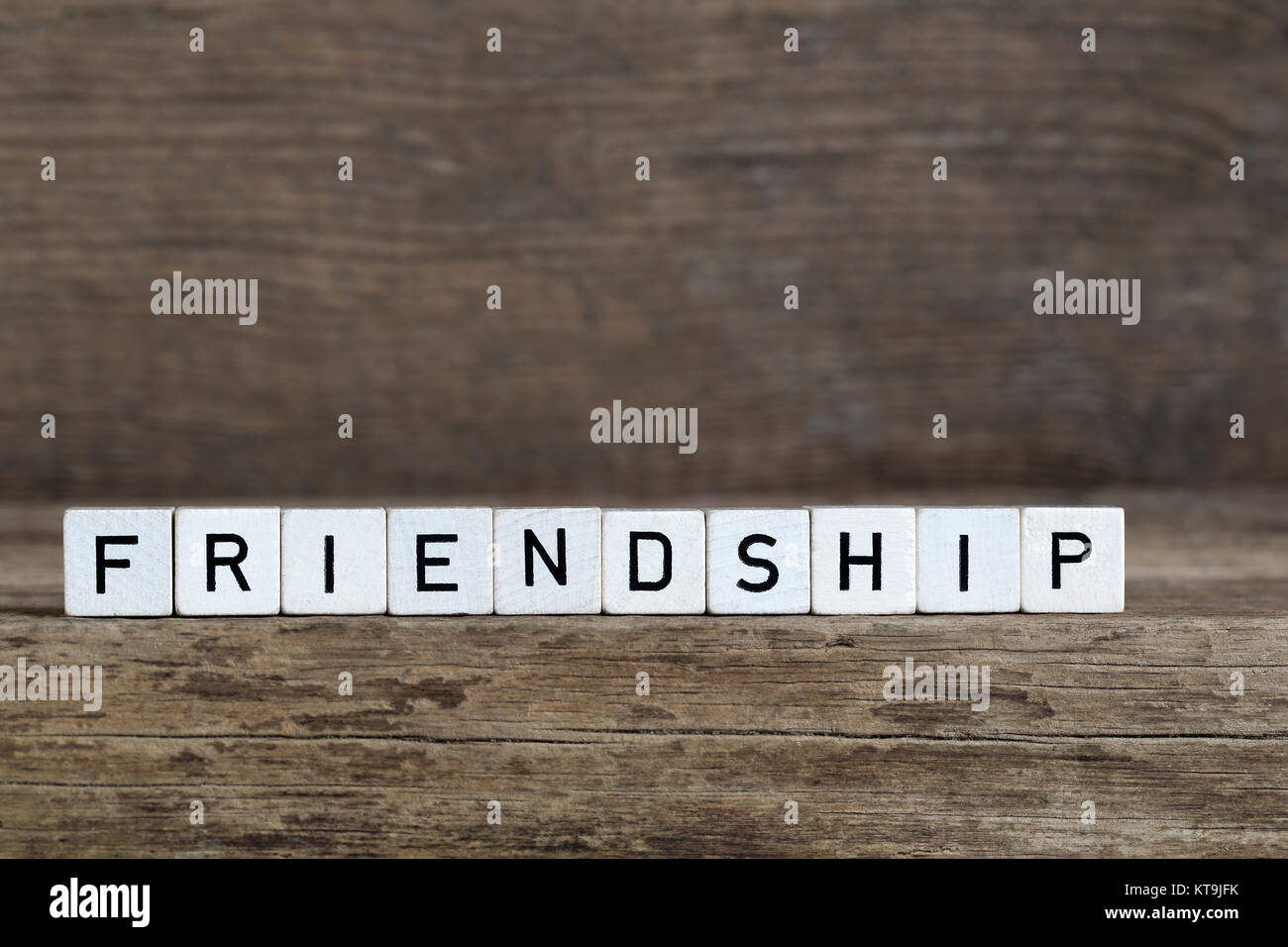 Friendship, written in cubes on a wooden background Stock Photo - Alamy