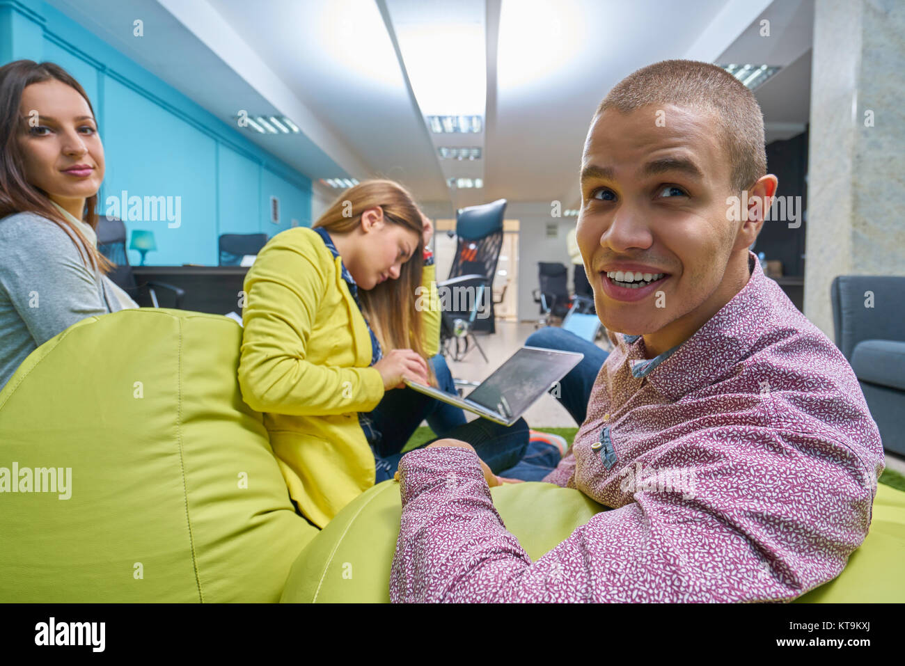 Portrait of startup group of creative people having a meeting with a ...