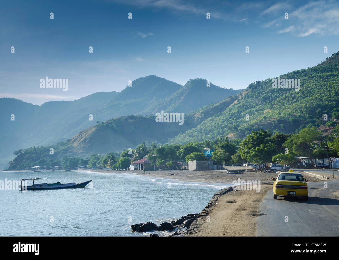 coast beach landscape view with boat and taxi near dili in east timor ...