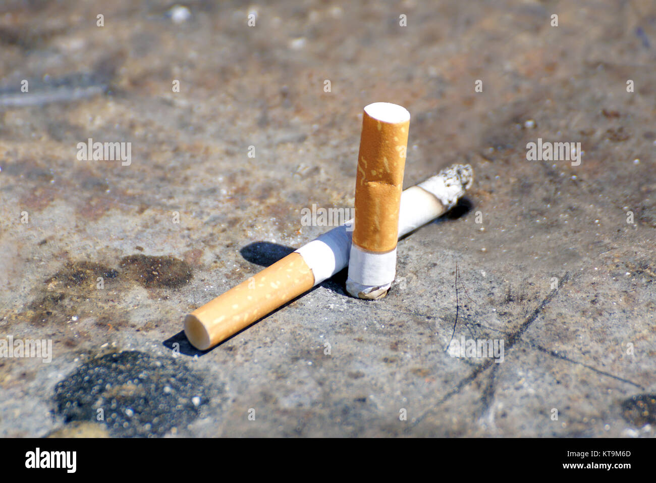 Used cigarettes in an ashtray Stock Photo - Alamy
