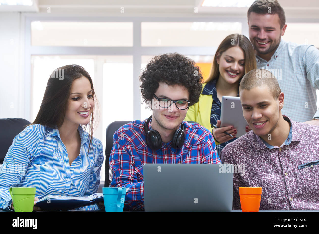 Portrait of startup group of creative people having a meeting with a ...