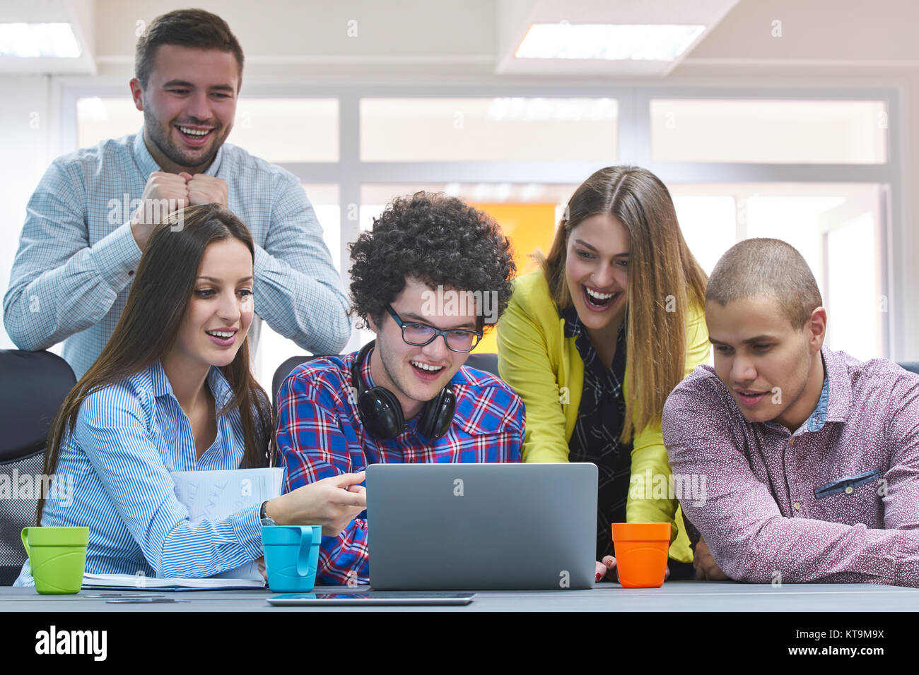 Portrait of startup group of creative people having a meeting with a ...