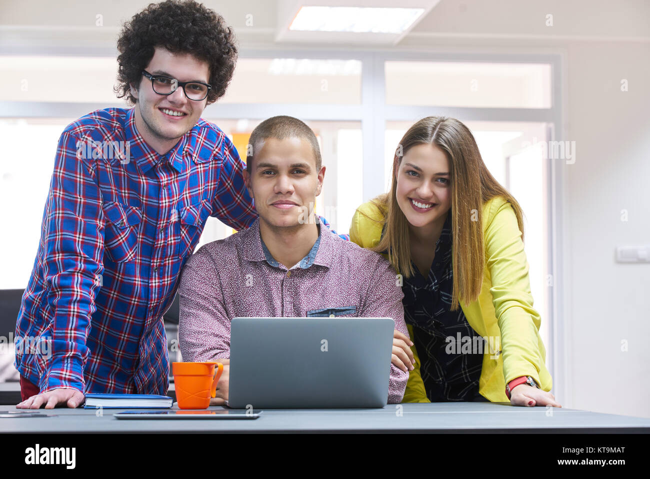 Portrait of startup group of creative people having a meeting with a ...