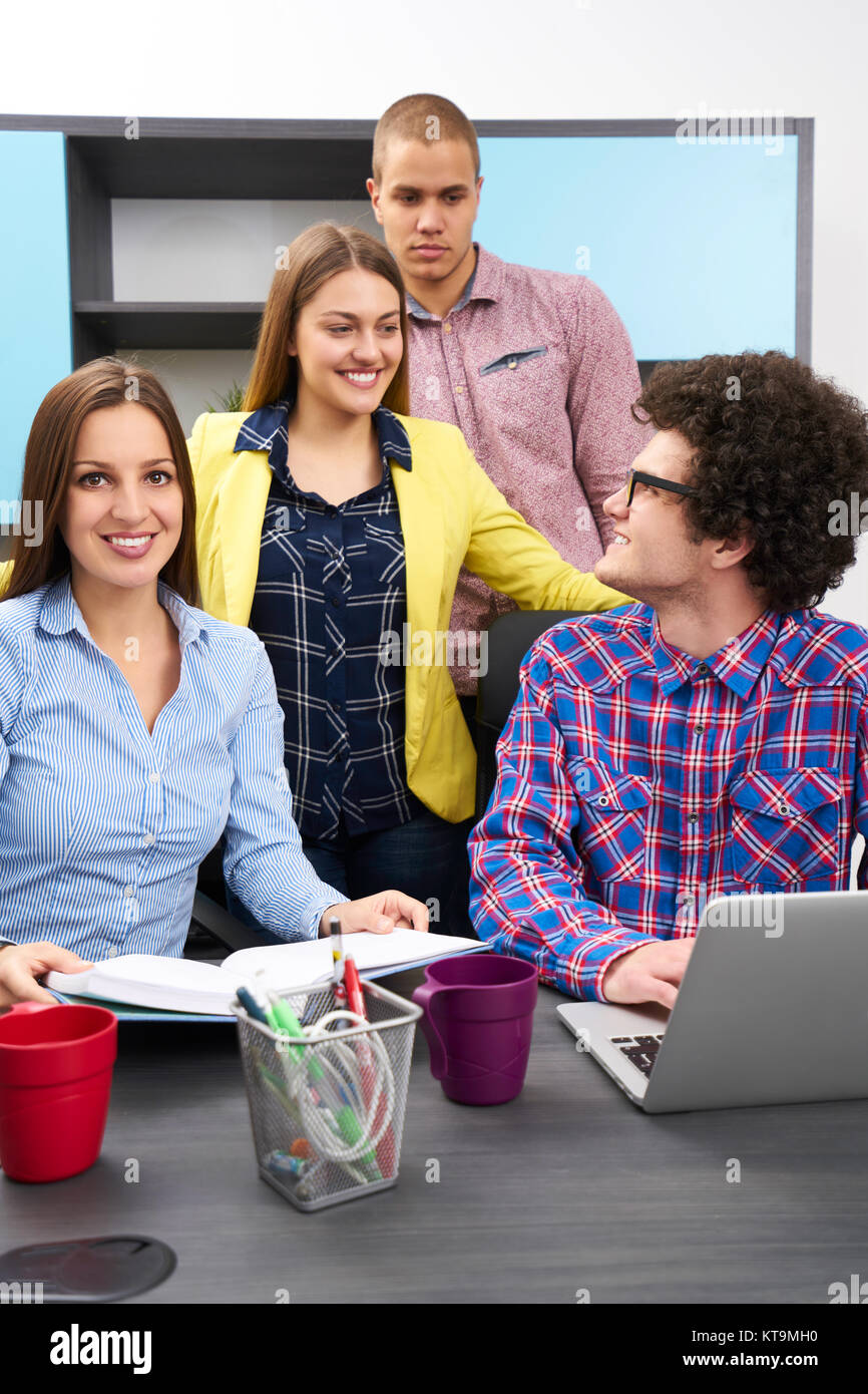 Portrait of startup group of creative people having a meeting with a ...