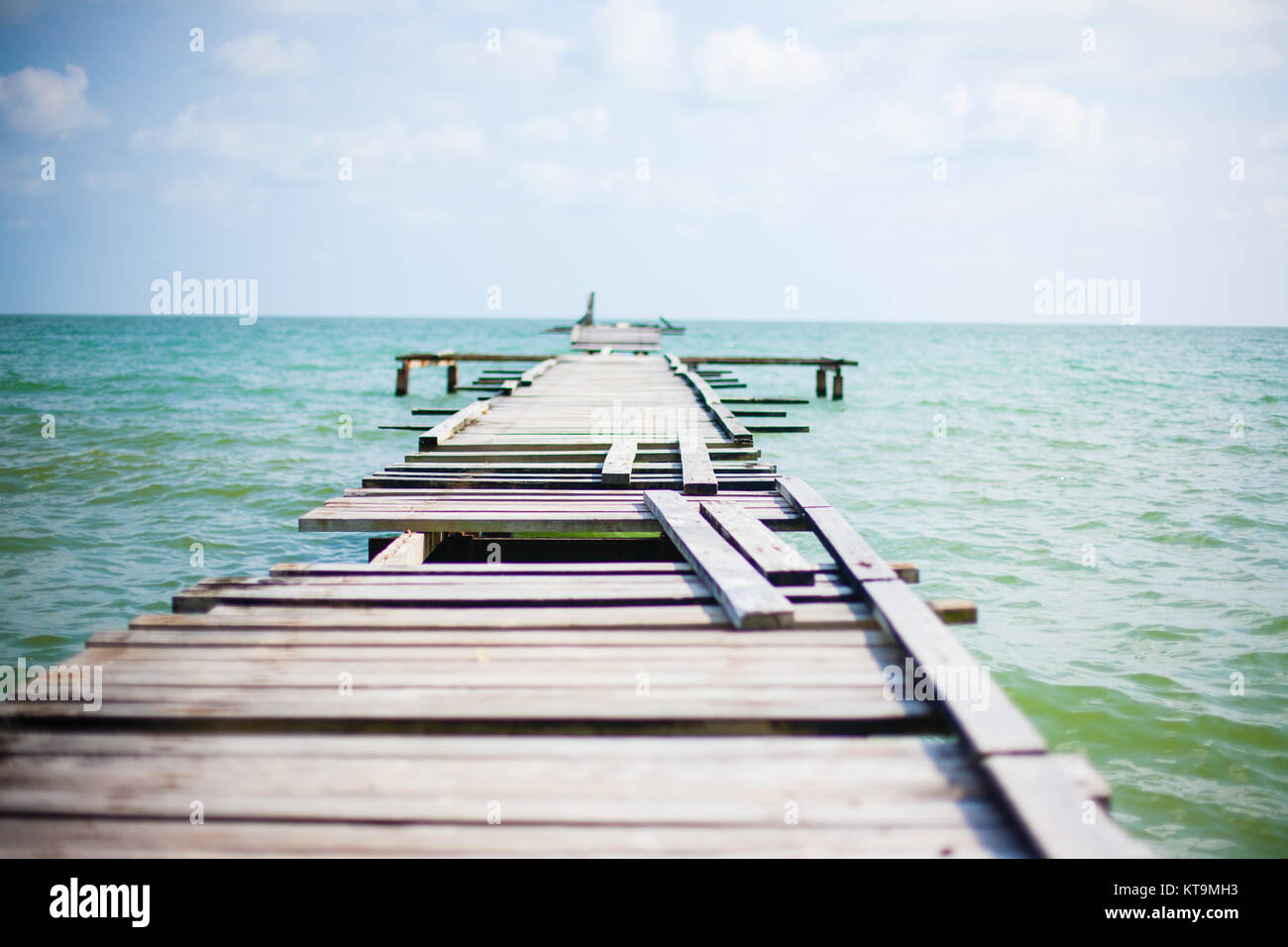 Wooden pier on the sea background Stock Photo - Alamy