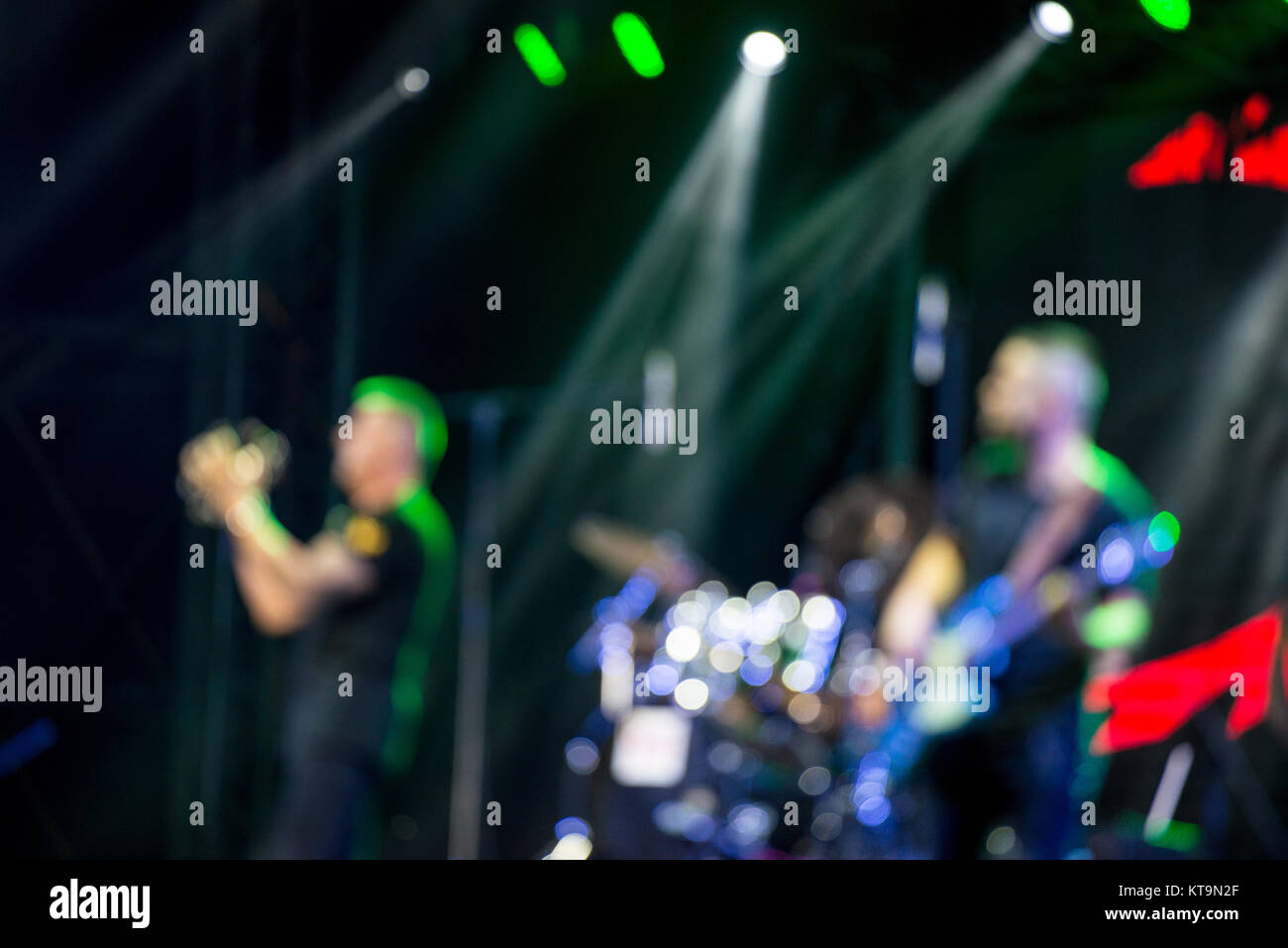 Abstraction of concert stage with blurry musicians during rock concert ...