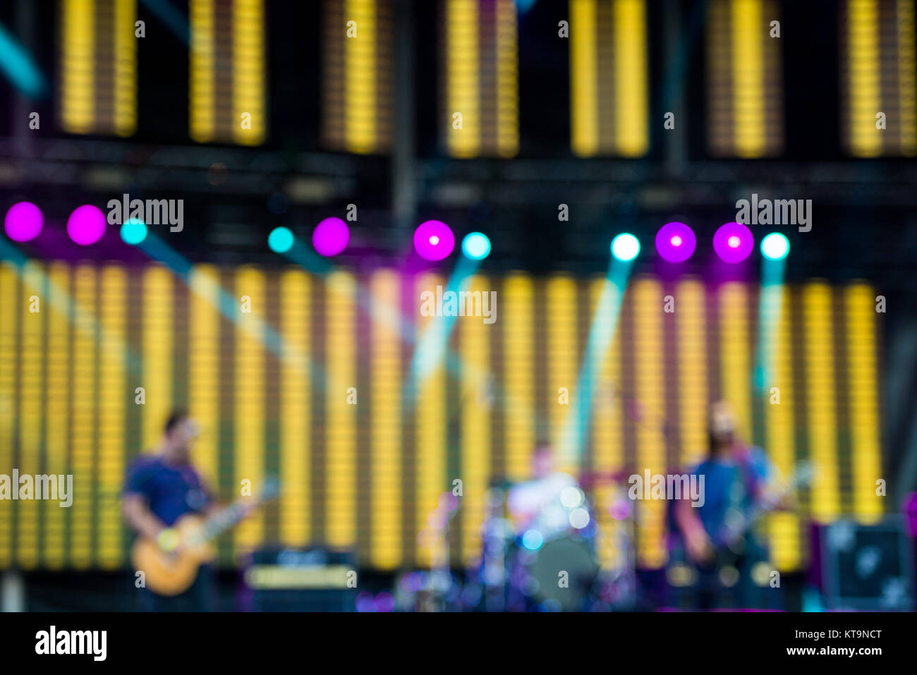 Abstraction of concert stage with blurry musicians during rock concert ...