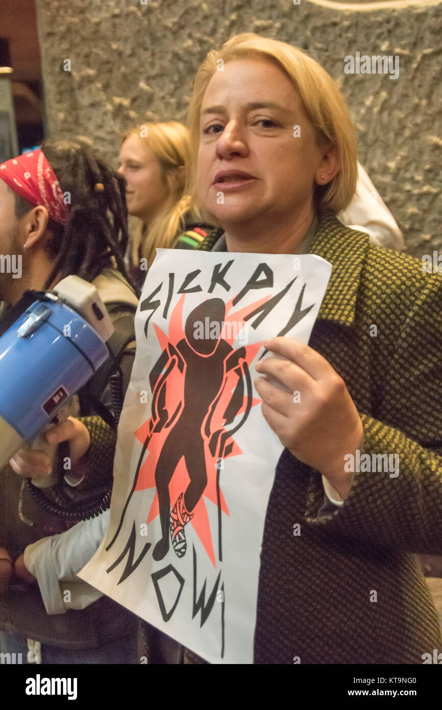 Green Party leader Natalie Bennett speaks holding a poster calling for ...