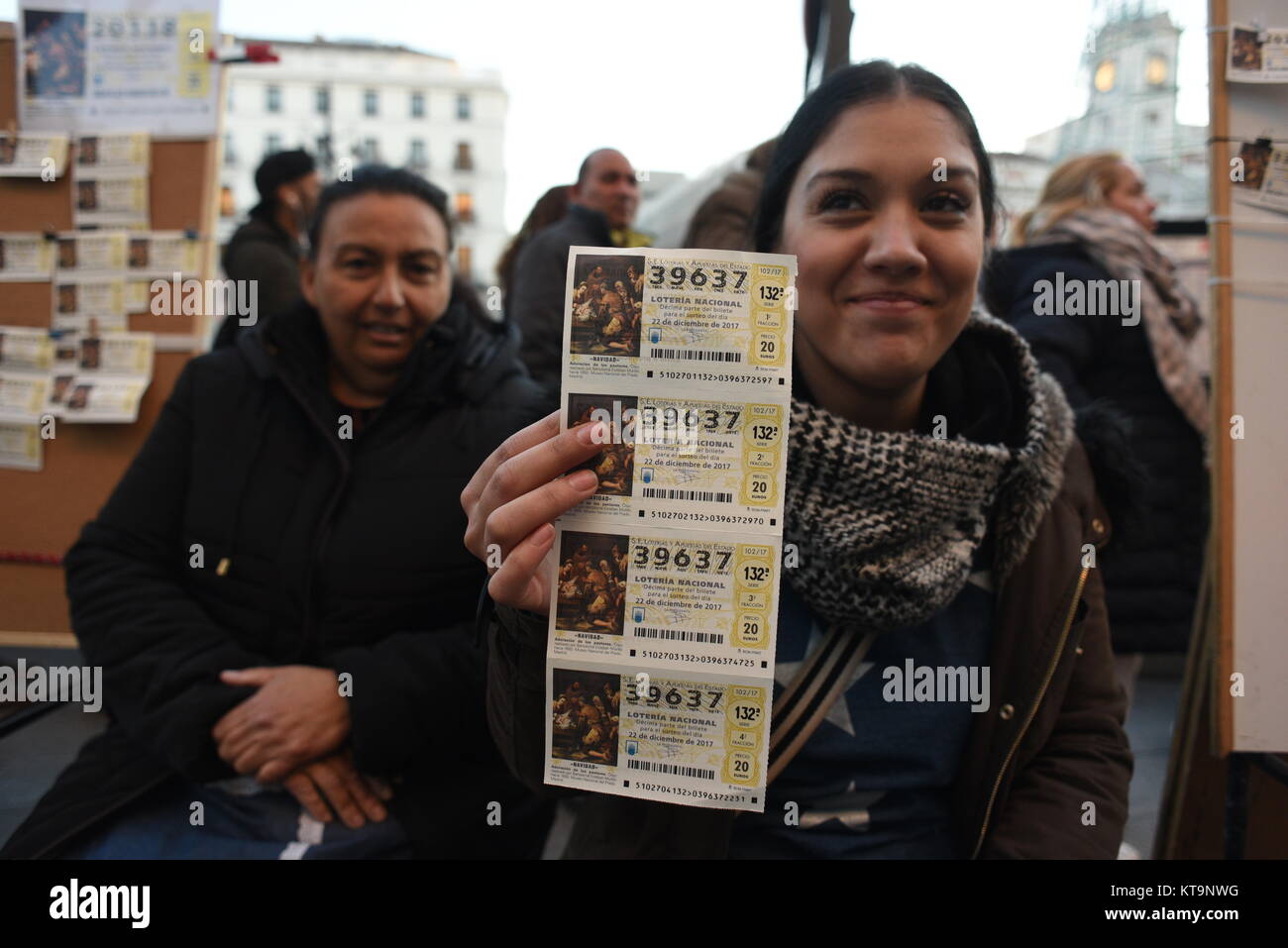 A vendor shows tickets of Spain's Christmas lottery in Madrid. (Photo ...