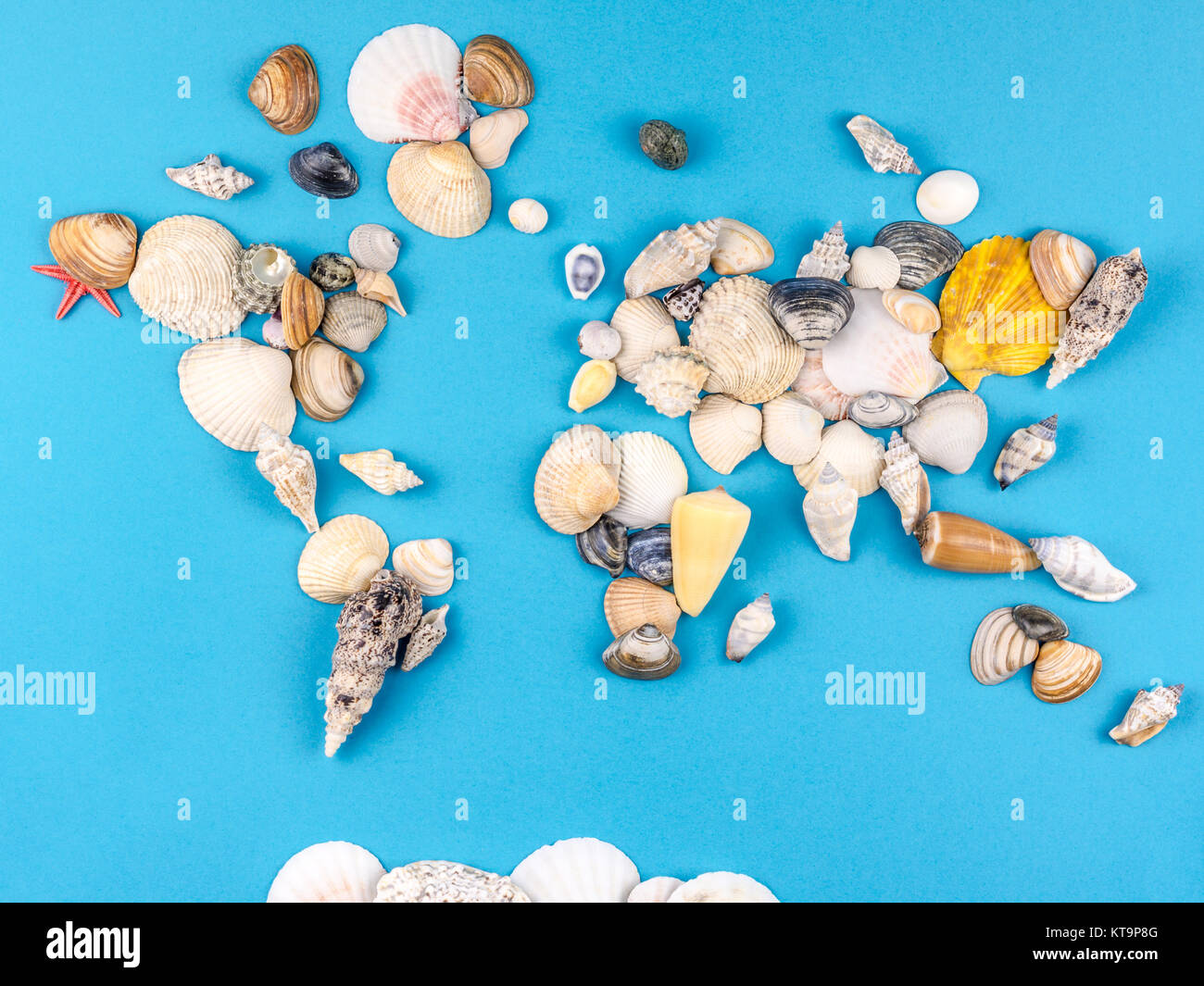 map of the world made of shells on blue background Stock Photo - Alamy