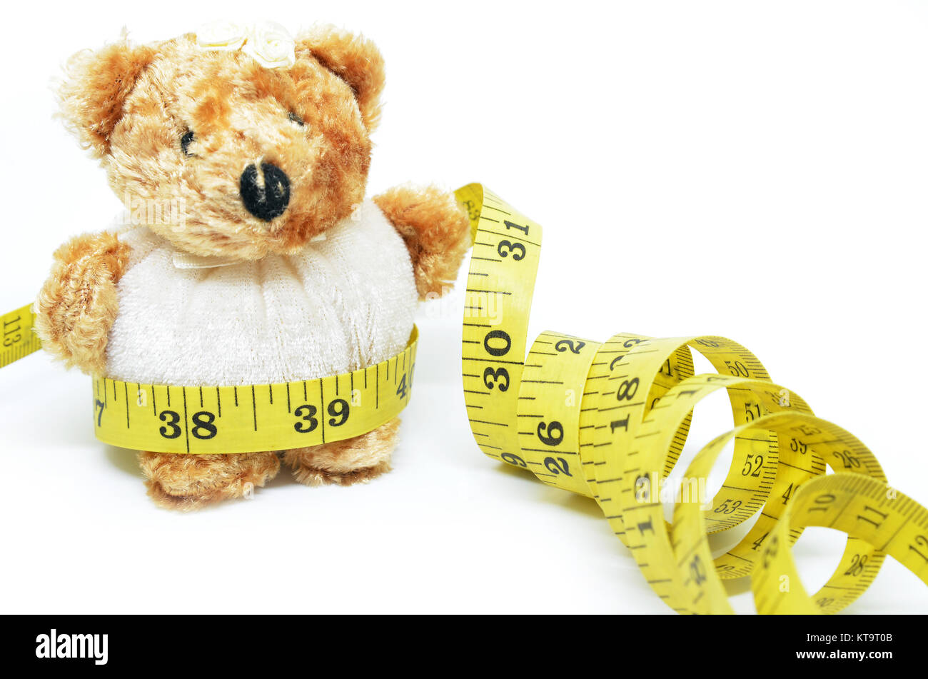 Teddy bear and measuring tape Stock Photo - Alamy