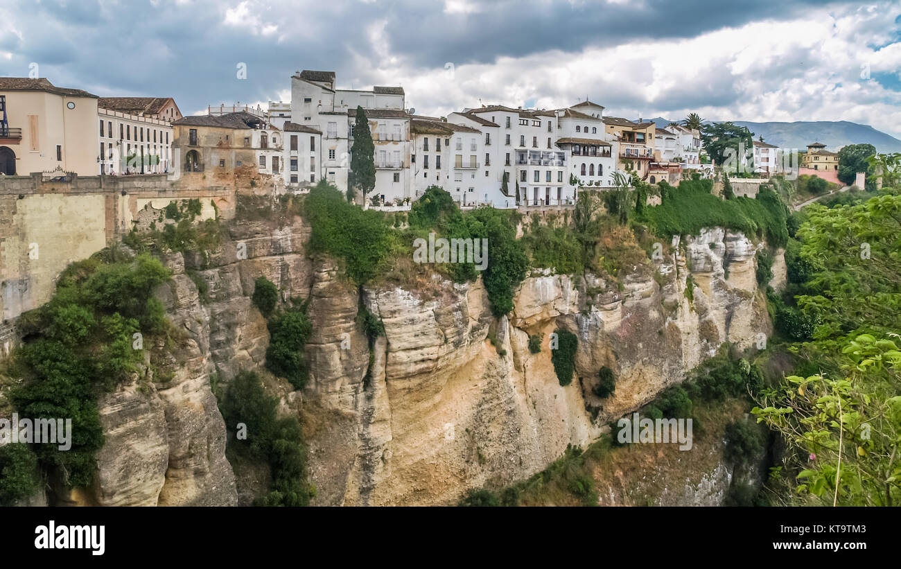 view of buildings over cliff in ronda, spain Stock Photo - Alamy