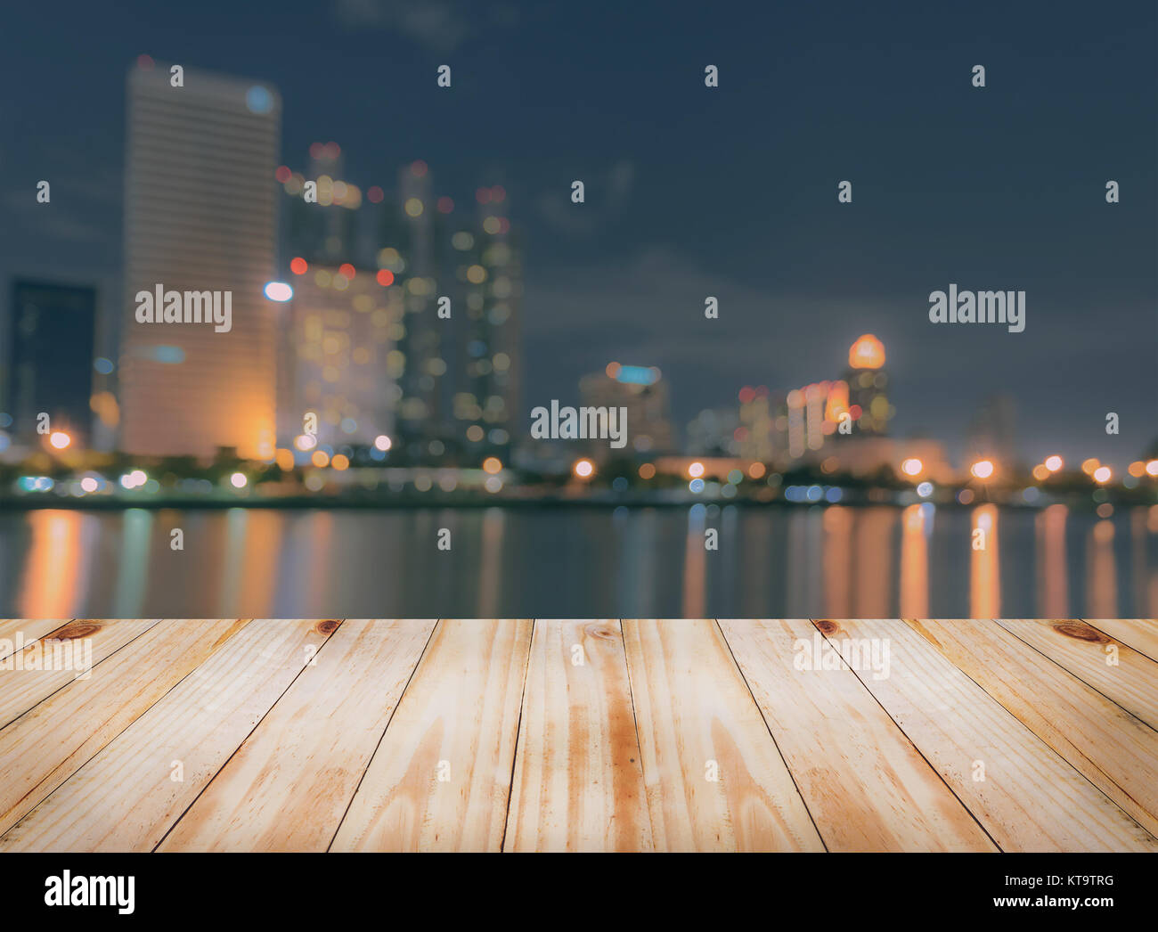 Empty wooden table with blurred city skyline background at night Stock ...
