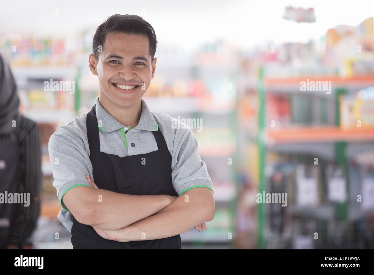 portrait of happy asian male shopkeeper Stock Photo - Alamy