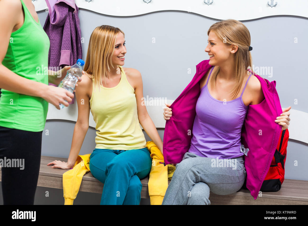 Young women in locker room before fitness training Stock Photo - Alamy