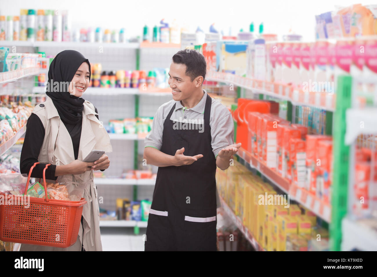 attractive female muslim customer buy some product at supermarket ...