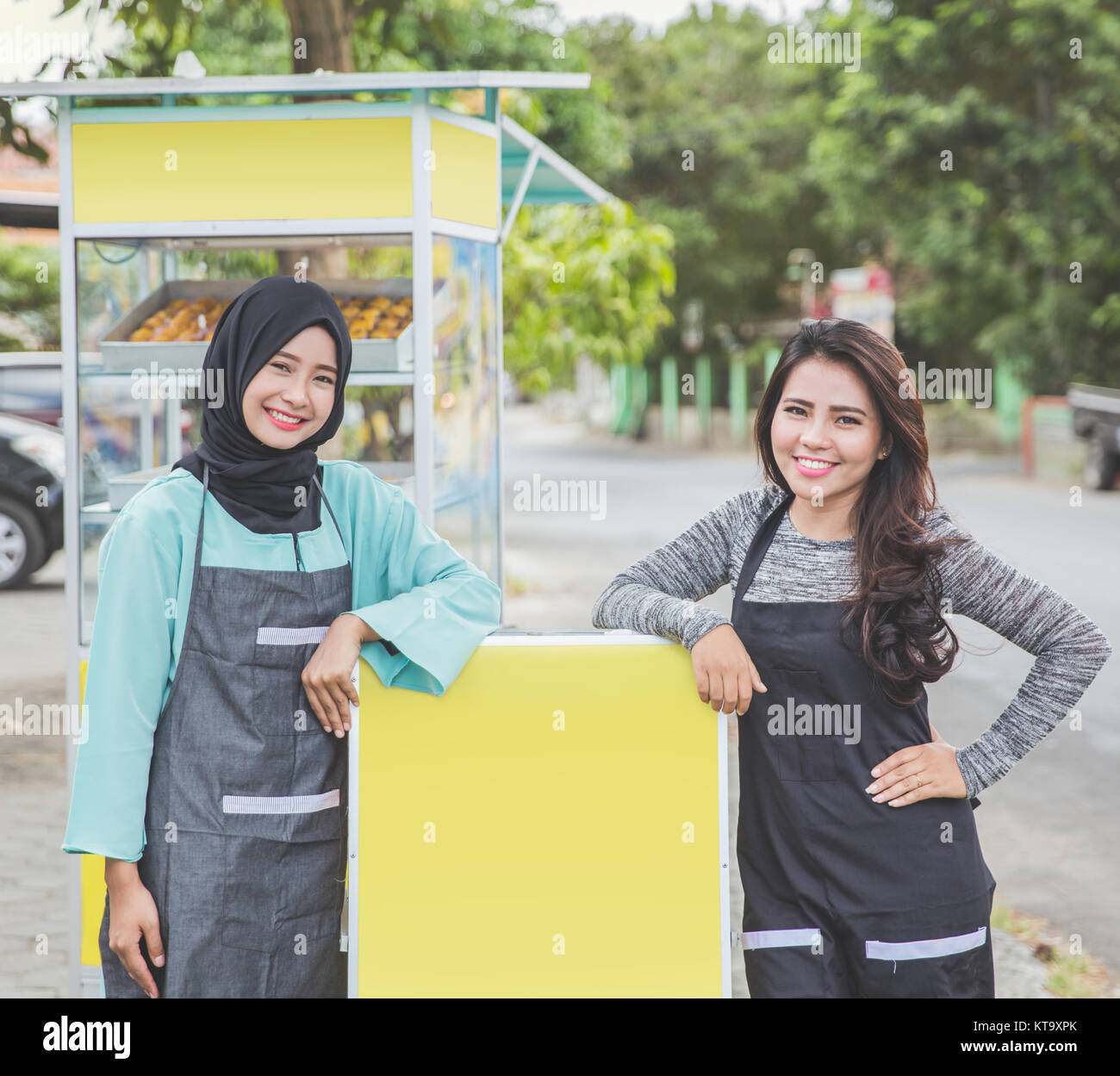young muslim entrepreneur with her partner starting their business by ...