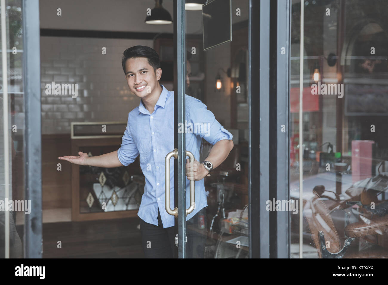 Confident young barber expert smiling welcoming customer to his ...