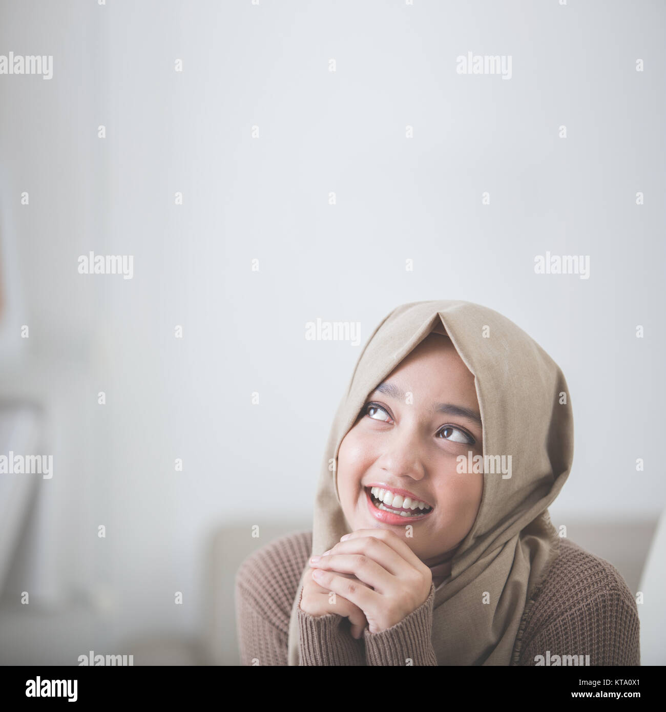 portrait of happy young asian woman thinking. close up Stock Photo - Alamy
