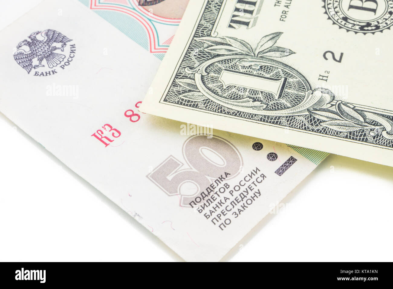 russian ruble and american dollar banknotes laying on white background ...