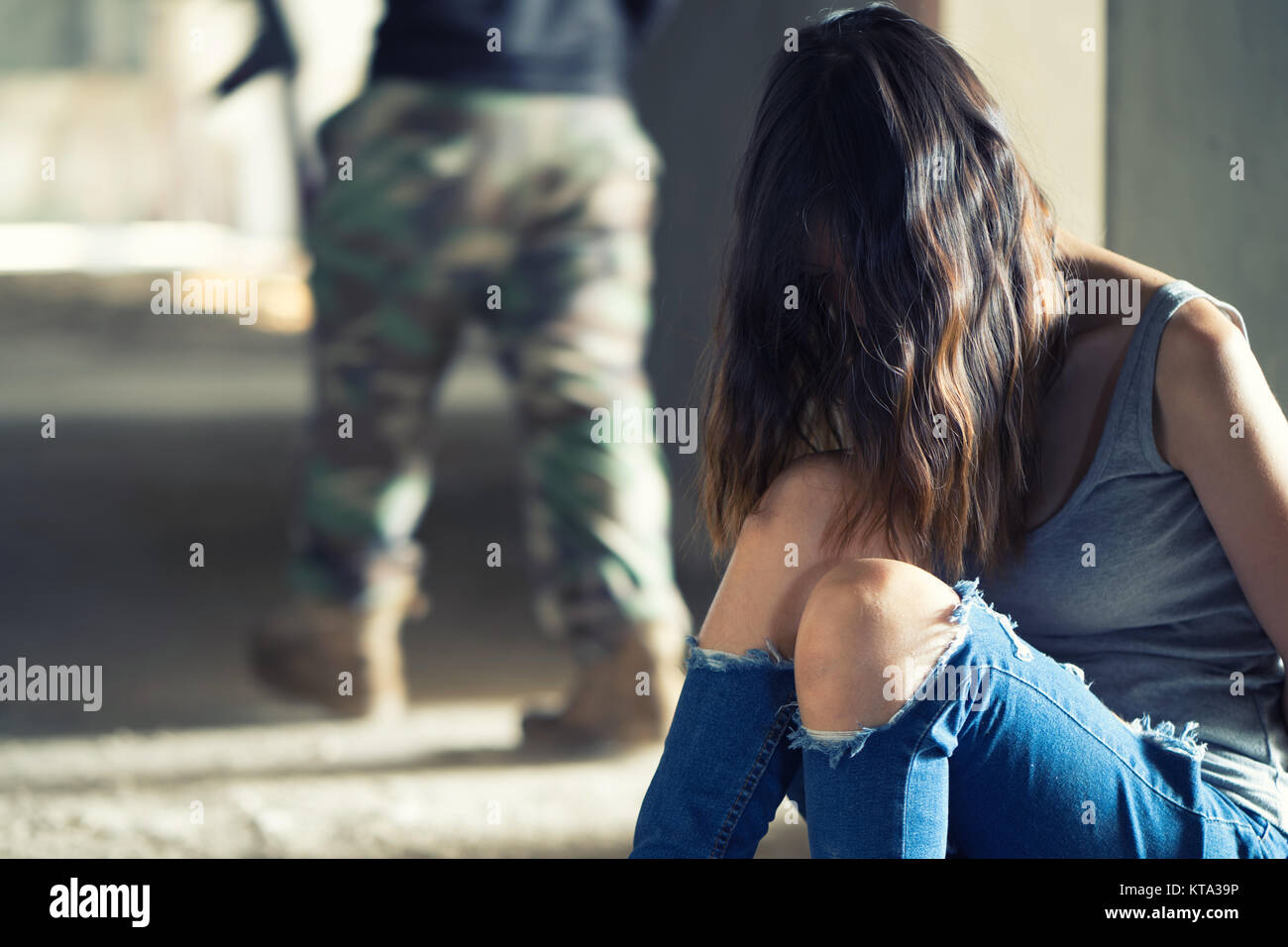 Man in balaclava threatening with gun to woman Stock Photo - Alamy