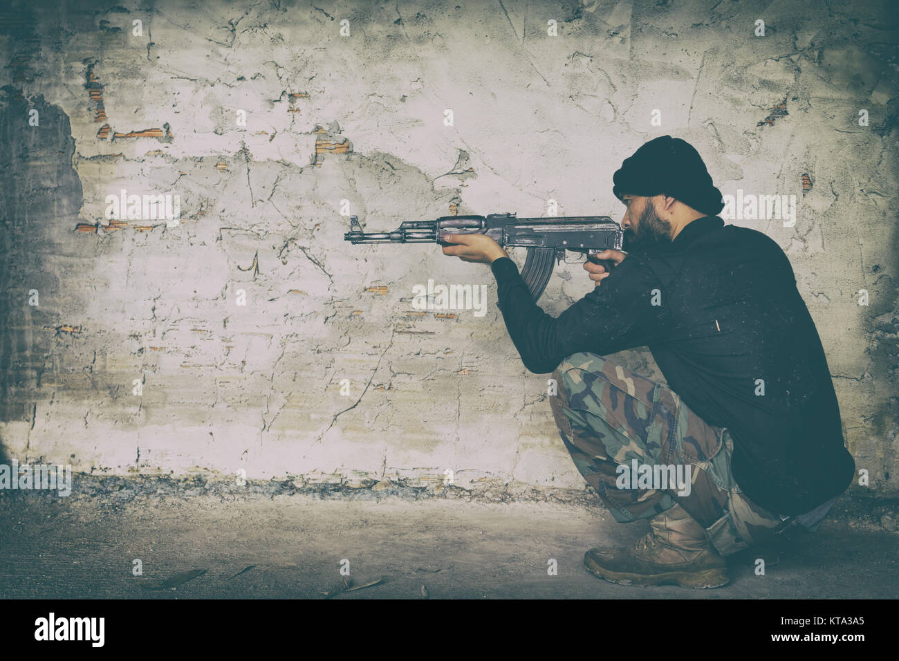 terrorist in black uniform and mask with kalashnikov Stock Photo - Alamy