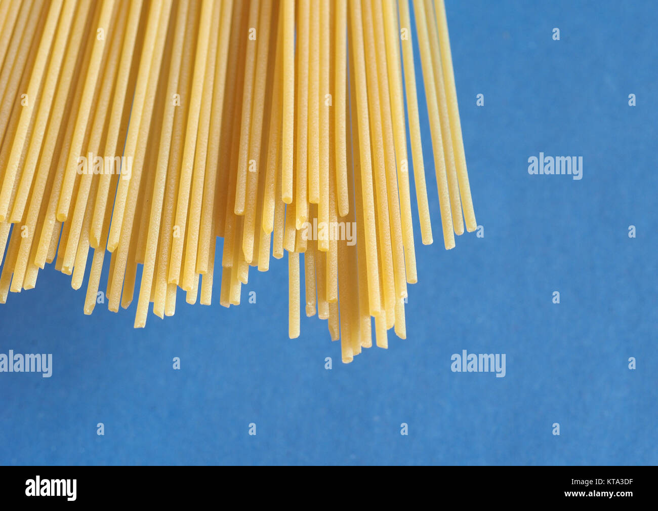 spaghetti pasta over blue Stock Photo - Alamy
