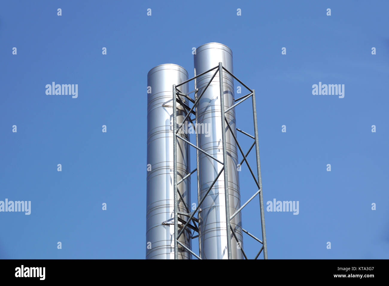 smokestacks with blue sky background Stock Photo - Alamy