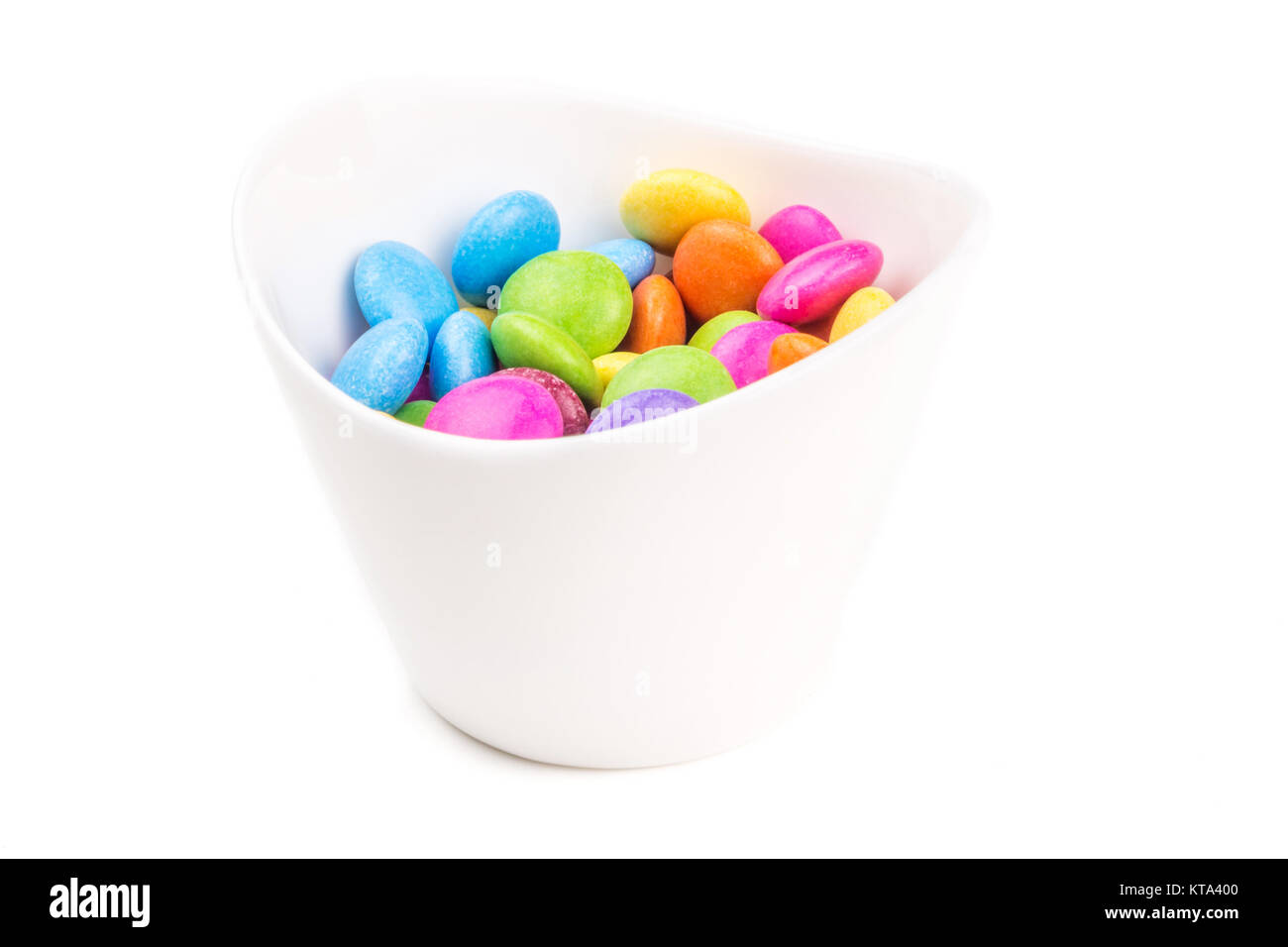 multicolored sweet choco lentils in a cup made of porcelain Stock Photo ...
