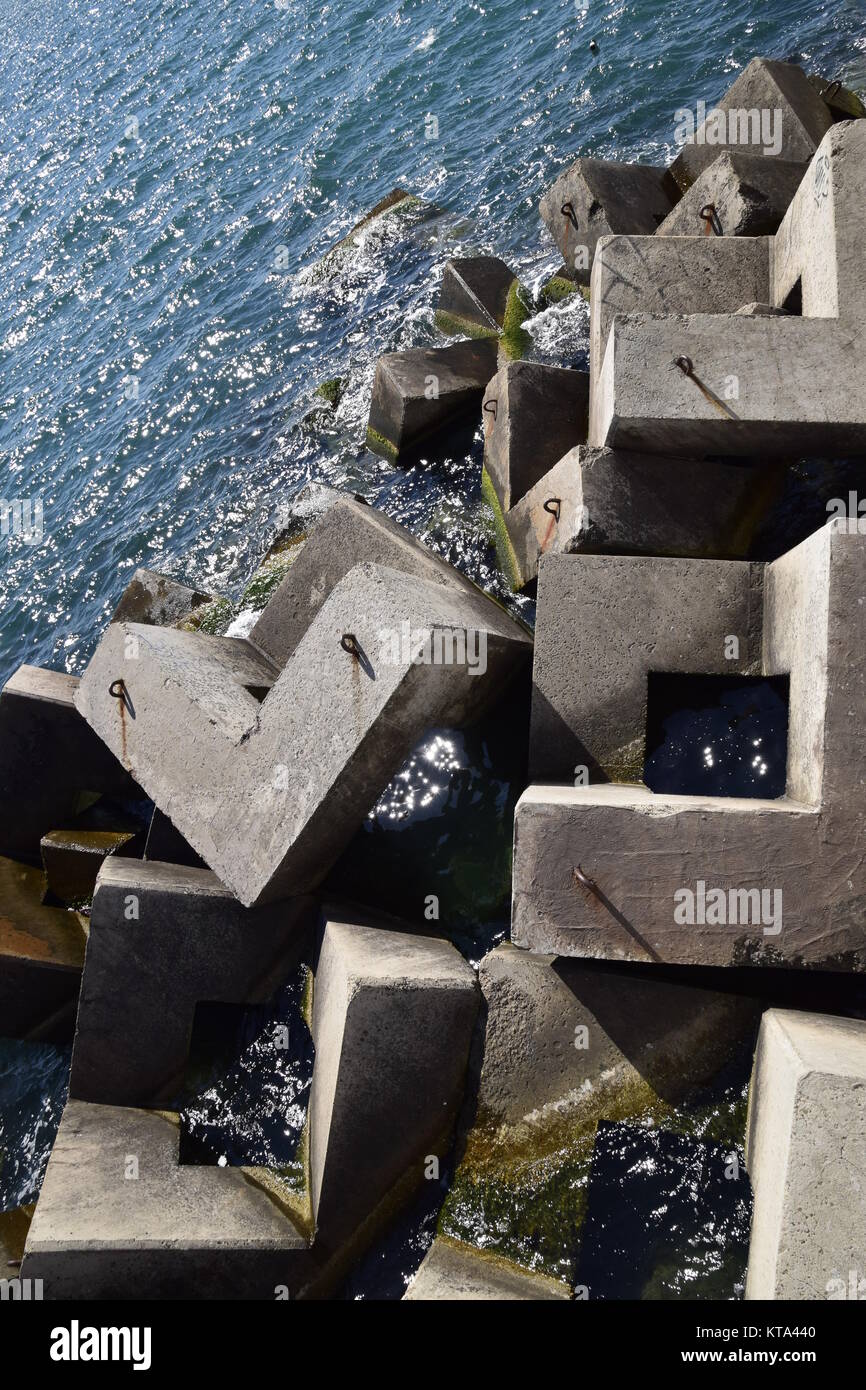 Breakwater of the rectangular stone figures Stock Photo - Alamy