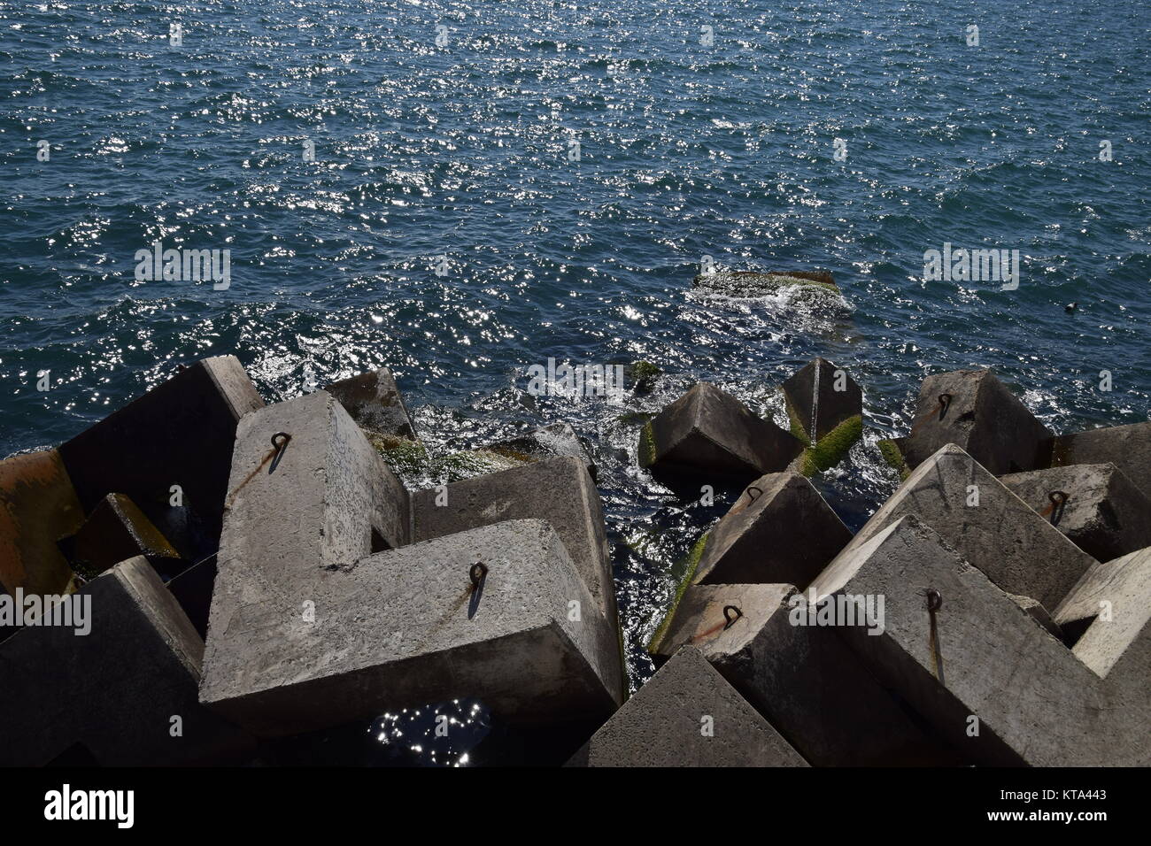 Breakwater of the rectangular stone figures Stock Photo - Alamy
