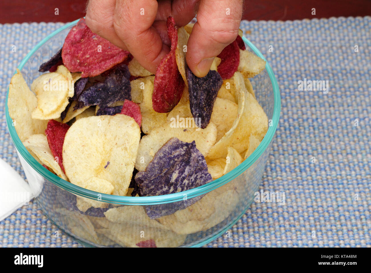 Choosing Red, White and Blue Potato Chips Stock Photo - Alamy