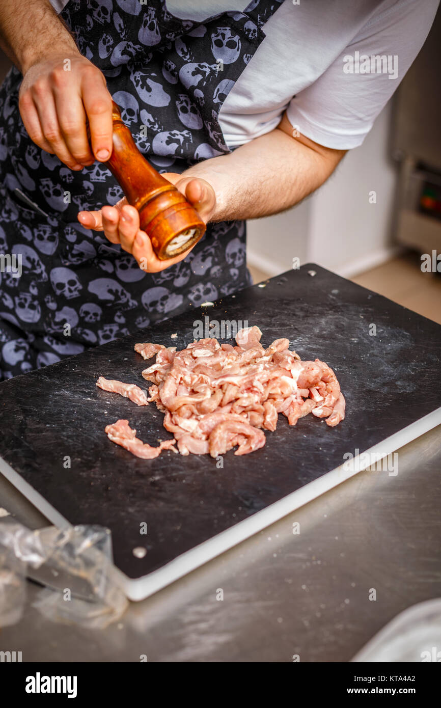 To sprinkle meat with salt hi-res stock photography and images - Alamy