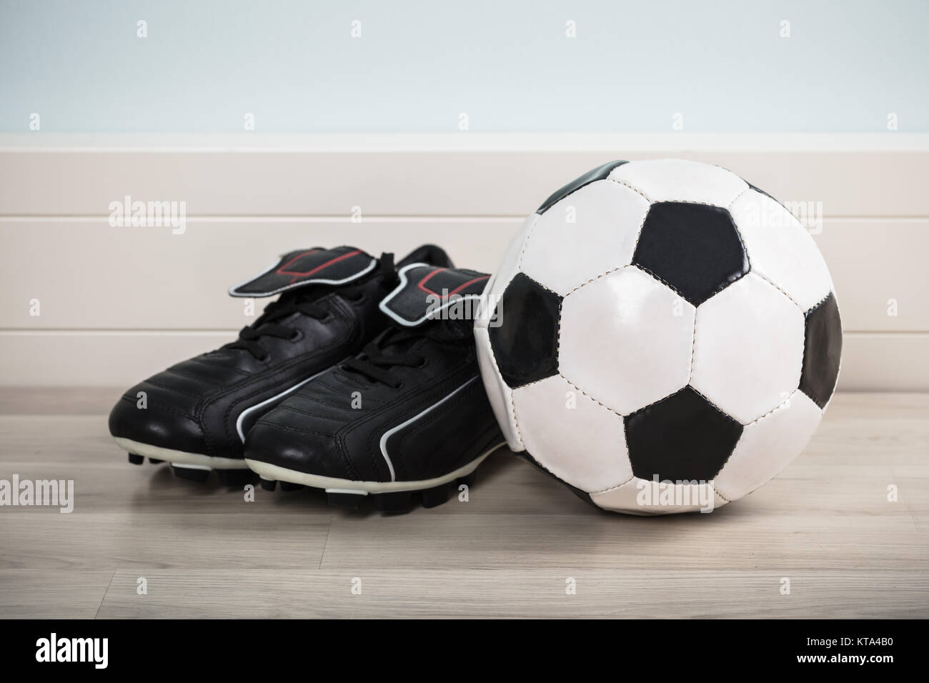 Pair Of Shoes With Football Stock Photo - Alamy