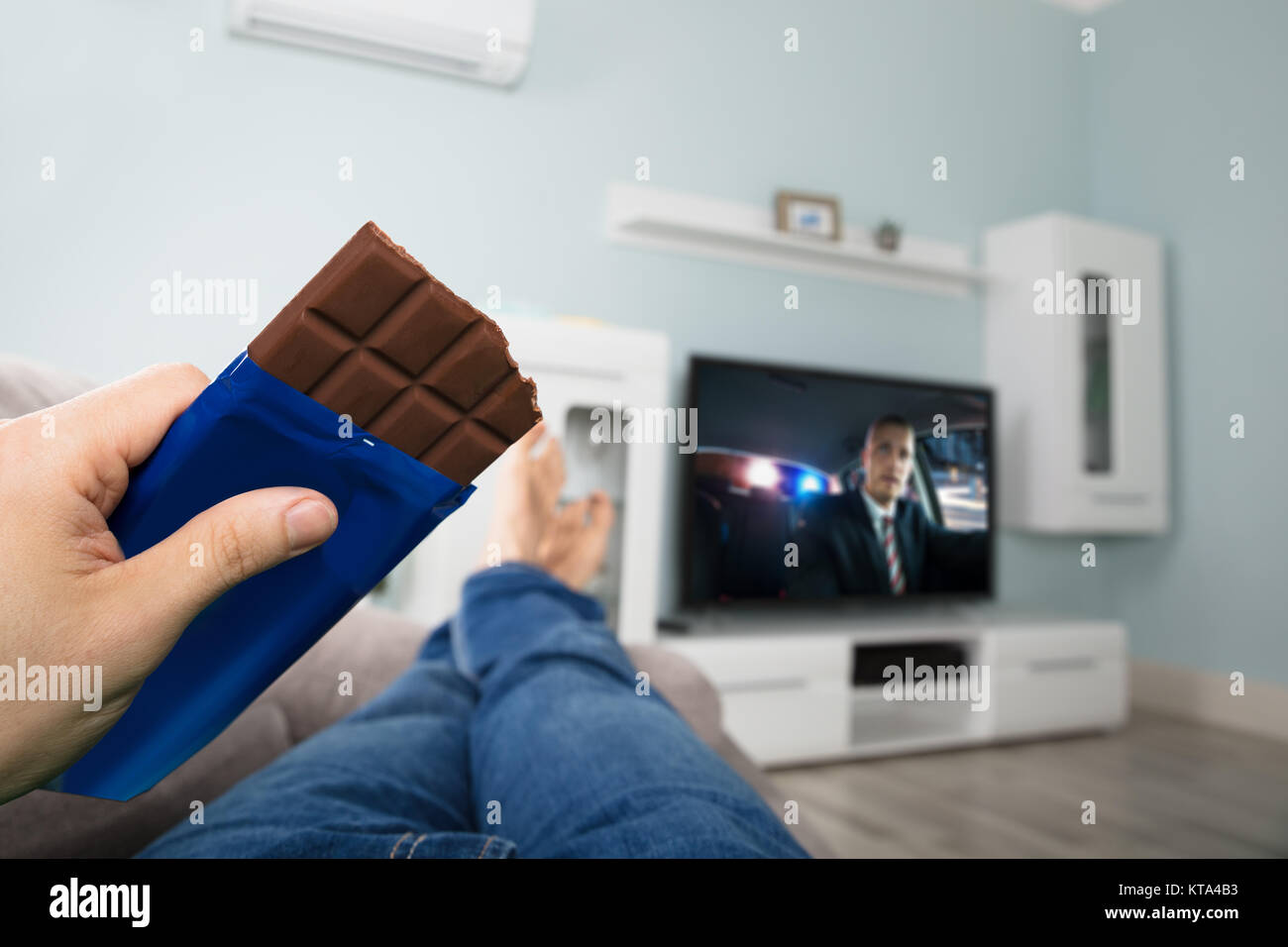 Person Enjoying Chocolate While Watching Television Stock Photo - Alamy Person Enjoying Chocolate While Watching Television Stock Photo - Alamy