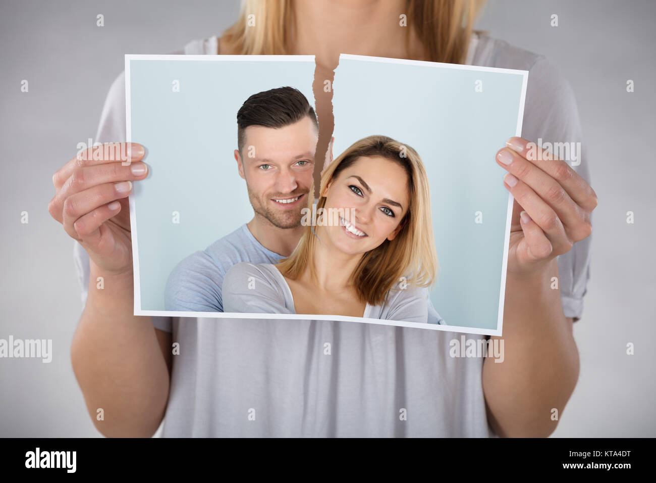 Woman Tearing Photo Stock Photo - Alamy